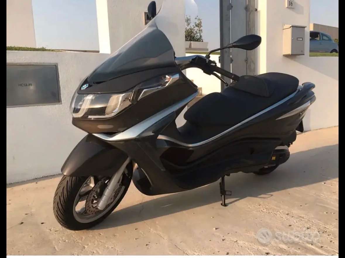 Piaggio X 102 caschi + telo copertura